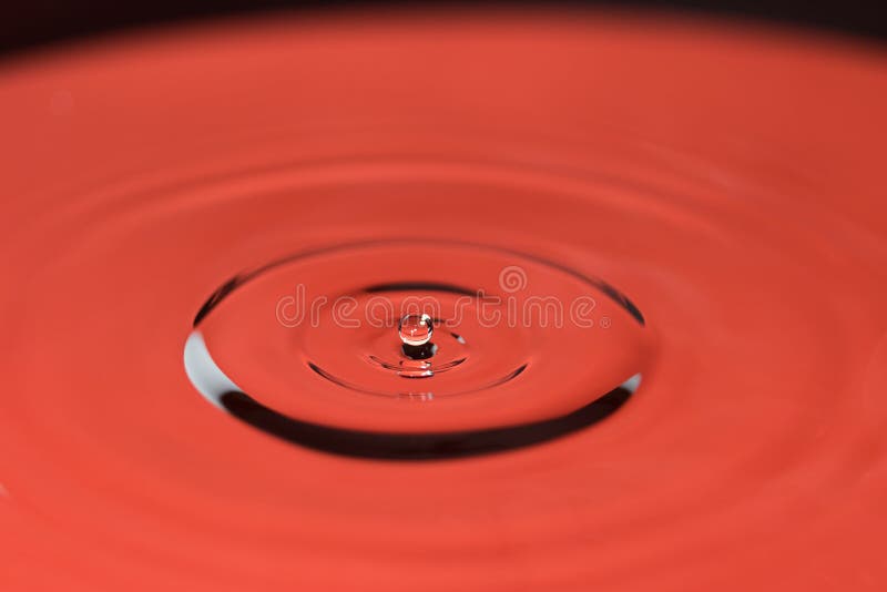 Closeup of Falling Water Drop in Red Stock Photo - Image of liquid ...