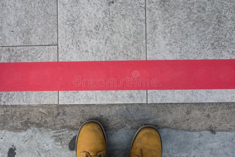 Feet Standing on the Pavement Behind the Red Line Stock Photo - Image ...
