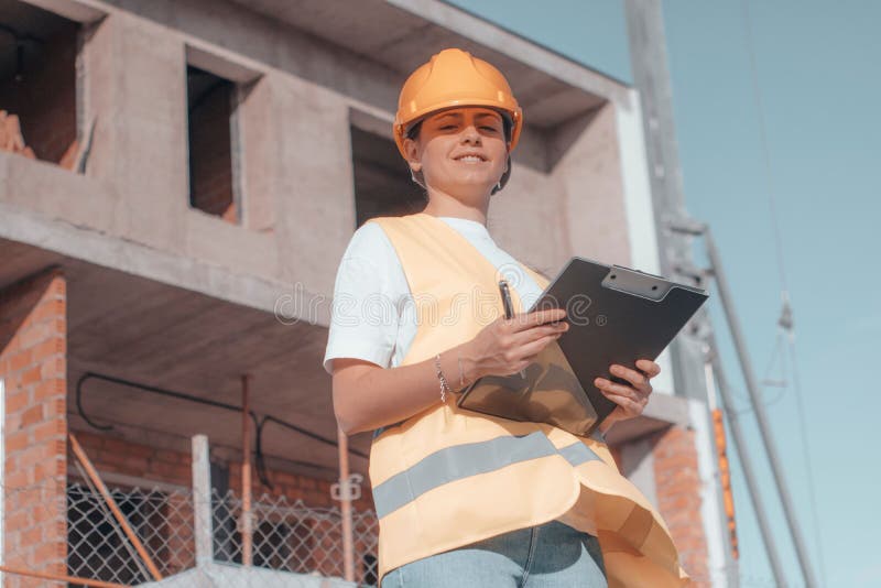 Closeup of a Female Builder Standing Near the Construction Site Stock ...