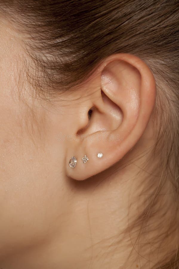 Female Ear with Three Earrings Stock Photo - Image of macro, style ...