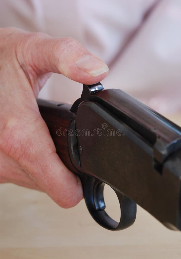Female Hand Putting Safety on Rifle Stock Photo - Image of body ...