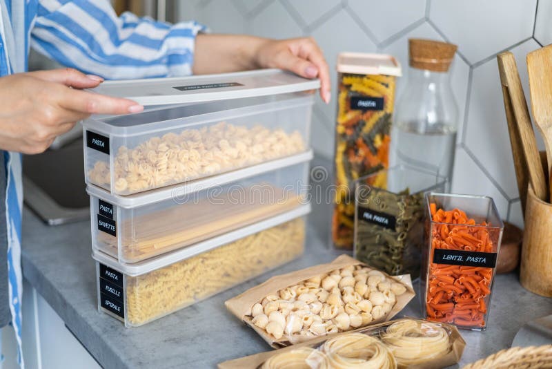 Closeup Female Hands Placing and Sorting Pasta into Pp Boxes. Storage ...
