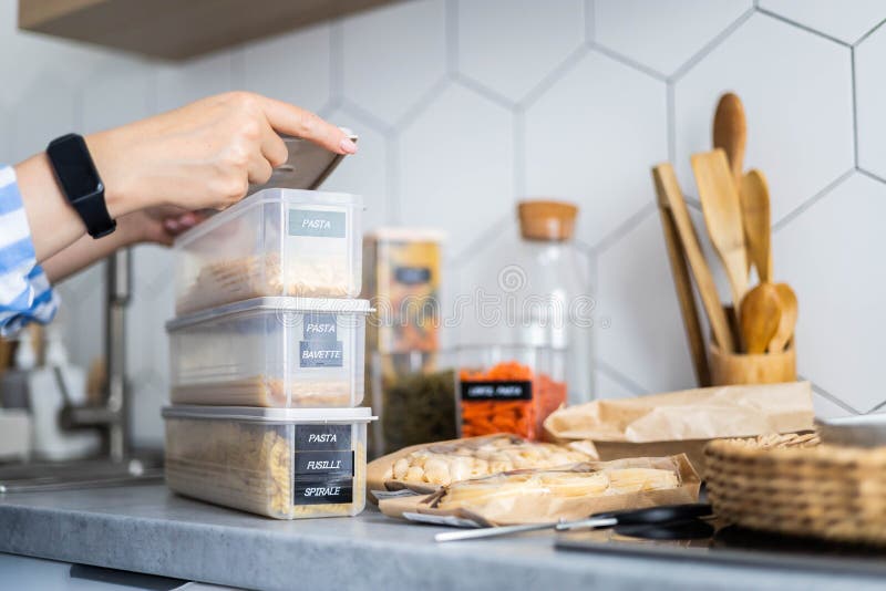Closeup Female Hands Placing and Sorting Pasta into Pp Boxes. Storage ...
