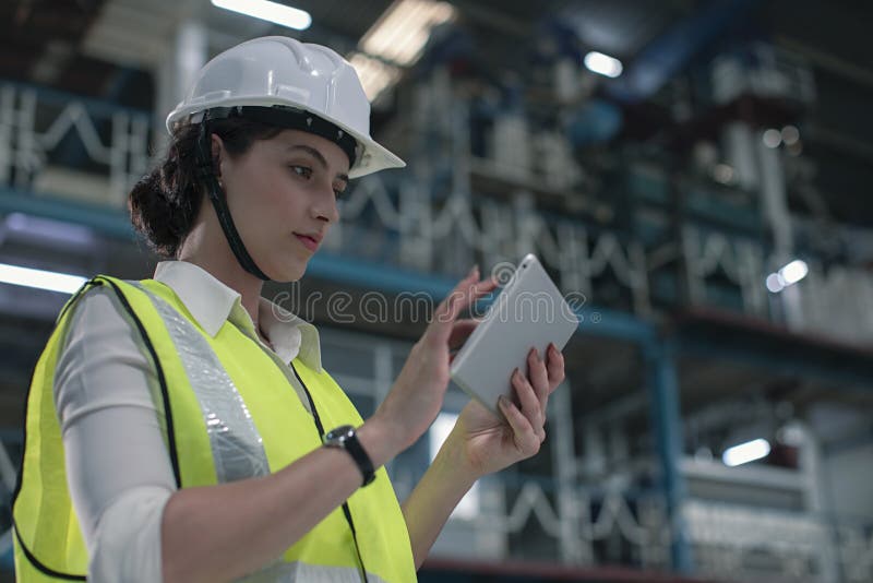 Closeup of a Female Technical Engineer Working on a Digital Tablet in ...