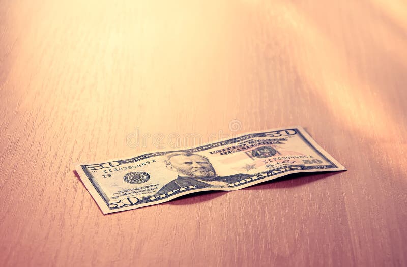 Closeup of Fifty Dollar Bills on Wooden Table Stock Photo - Image of ...