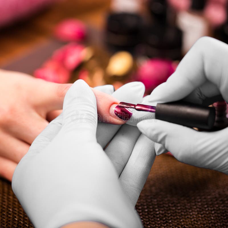 Closeup Finger Nail Care By Manicure Specialist In Beauty Salon Stock