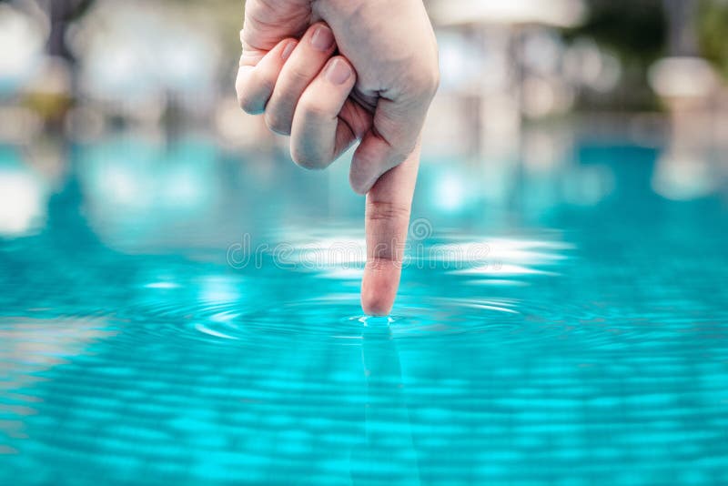 Closeup of the Finger Touching the Water Surface. Stock Image - Image ...