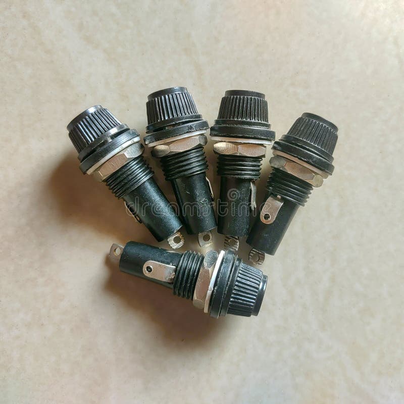 Closeup of Five Black Panel Mount Fuse Holders in a Fan-like Pattern on ...