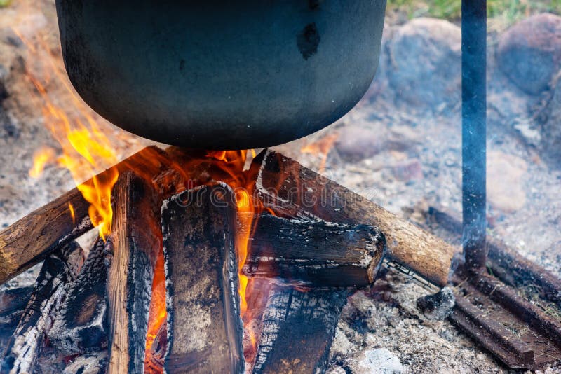 Closeup of Food Pot Hangs Over Burning Fire. Stock Photo - Image of ...