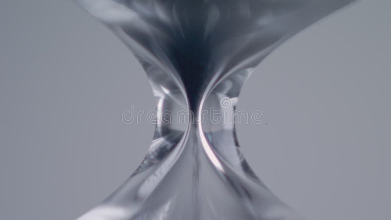 Closeup Footage of the Black Sand Falling through the Hourglass, with ...
