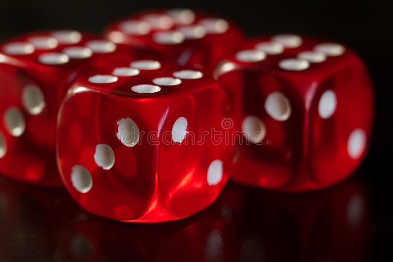 Closeup of a Four Red Dice with a Winning Number on the Top Face on a ...