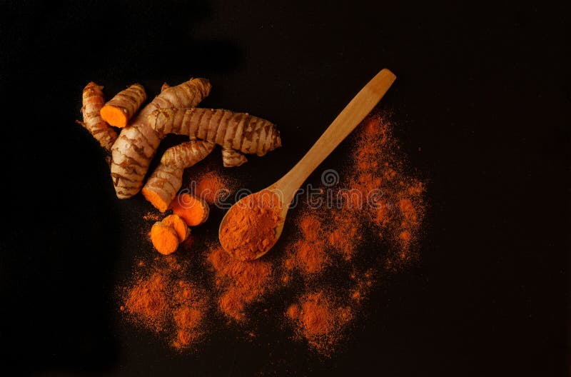 Closeup of Fresh Turmeric Root and Ground Turmeric Stock Photo - Image ...