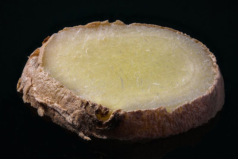 Closeup of a Freshly Cut Ginger Slice on a Black Background Stock Image ...