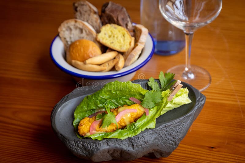 Closeup of a Fried Chicken Served with Lettuce and Vegetables on a ...