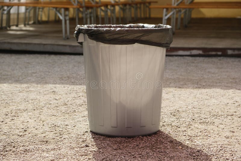 Closeup of a Garbage Bin with a Black Plastic Bag Inside on a Sunny Day ...