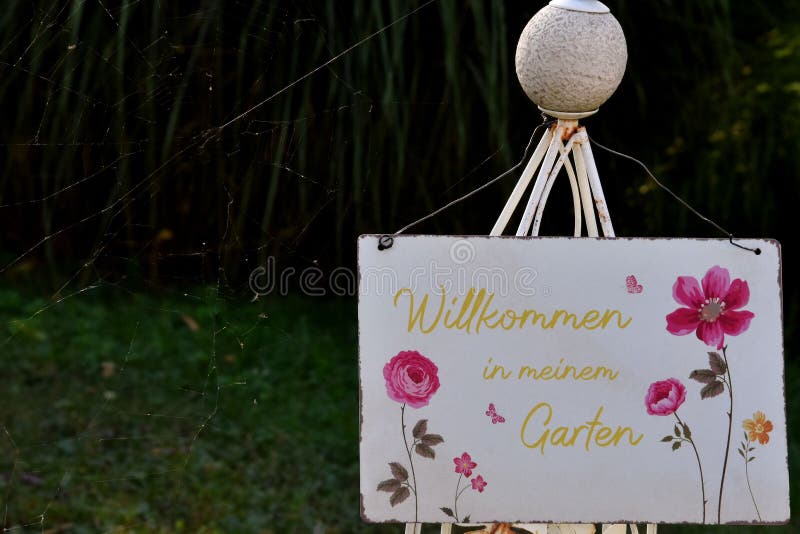 Closeup of Garden Welcome Sign with Flowers Stock Photo - Image of ...