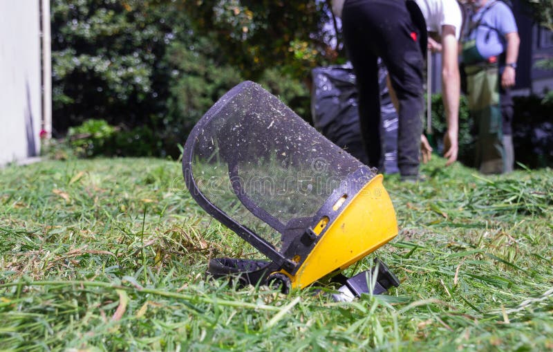 Closeup of a Gardening Protection Helmet on the Grass. Stock Photo ...