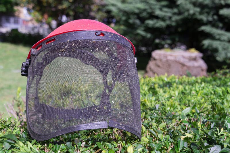 Closeup of a Gardening Protection Helmet on the Grass. Stock Image ...