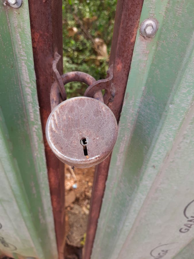 Gate is Locked with Steel or Iron Rusted Lock in a Empty Space or Field ...
