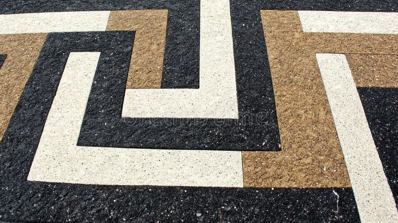 Closeup of a Geometric Pattern on Pavement with White Brown and Black ...