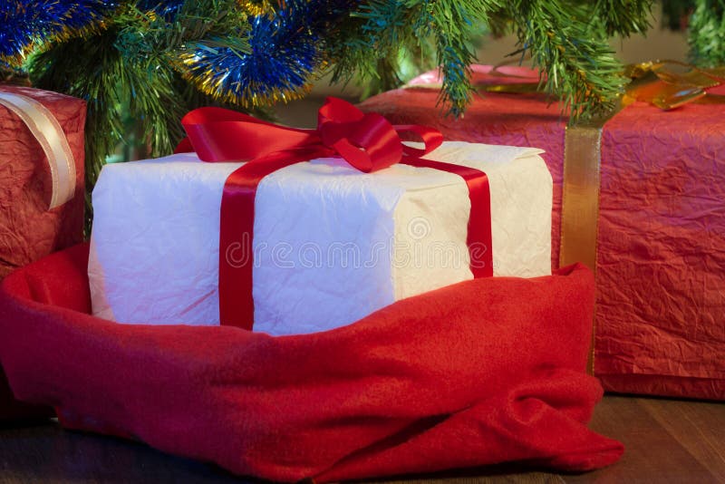 Closeup Gift and Green Christmas Tree Stock Photo - Image of season ...