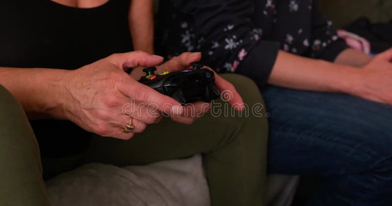 Closeup of Girls Playing Video Games with Xbox One Controller on the ...