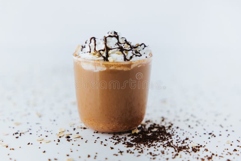Closeup of a Glass of Hot Chocolate on a Table, with Cream on Top and ...