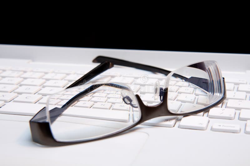 Closeup Glasses on a Keyboard Stock Image - Image of notebook, glasses ...