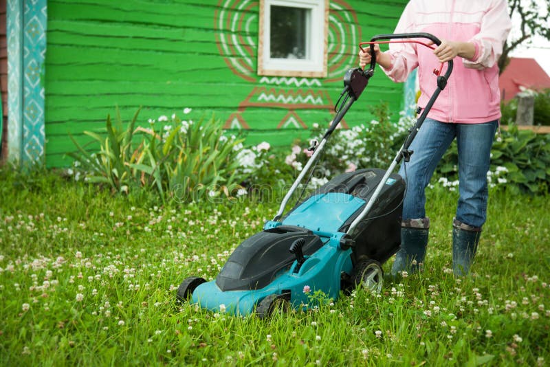 Closeup of grassmower stock photo. Image of summer, backyard - 96143436