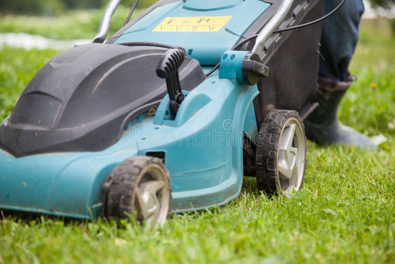 Closeup of grassmower stock photo. Image of work, gardening - 96143522