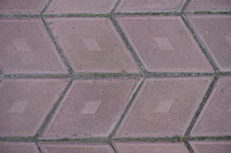 Closeup of Grayish Pink Diamond Shaped Concrete Pavement with Geometric ...