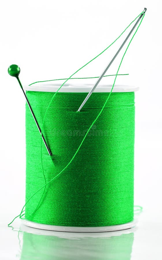 Bobbin Of Green Sewing Thread With Pin Stock Photo - Image of ...