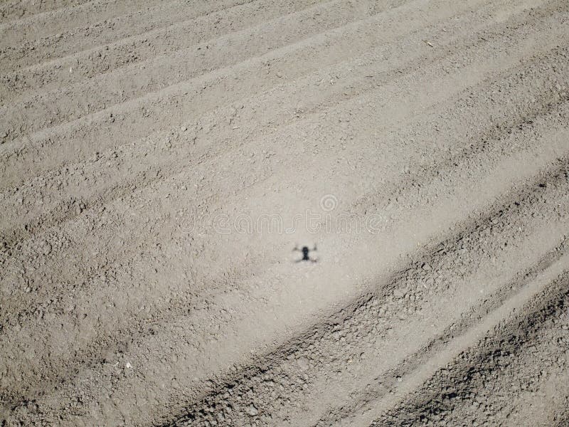 Closeup of Ground with a Drone Shadow Stock Photo - Image of ground ...