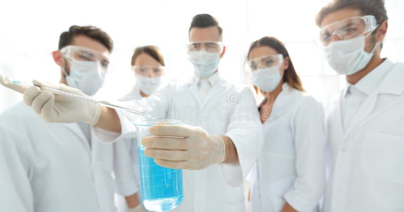 Closeup of a Group of Medical Workers Working with Liquids Stock Photo ...