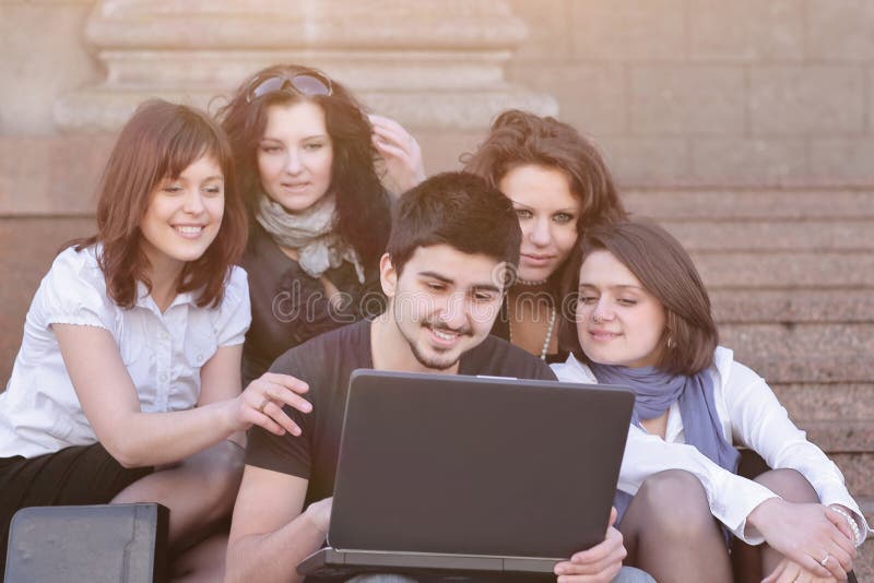 Closeup. Groups of Students with a Laptop Stock Photo - Image of ...