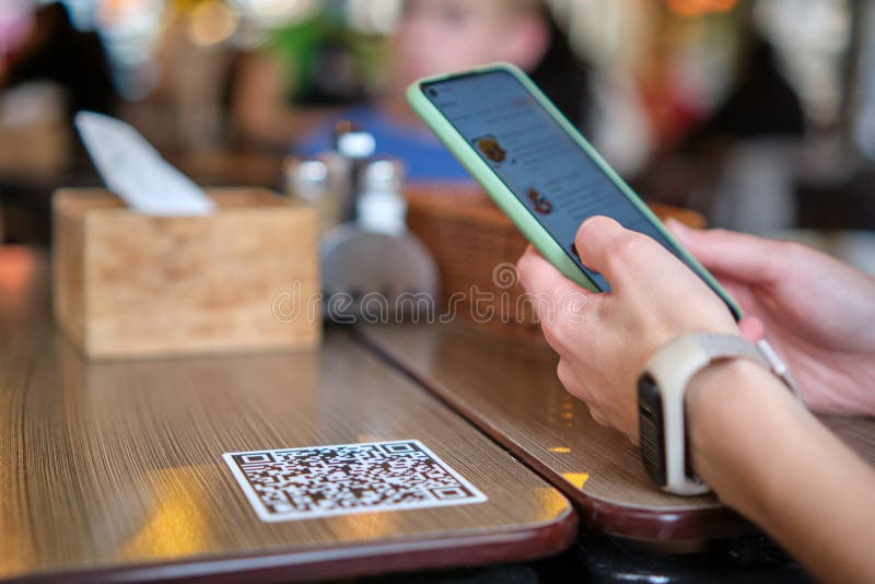 Closeup of Guest Hand Ordering Meal in Restaurant while Scanning Qr ...