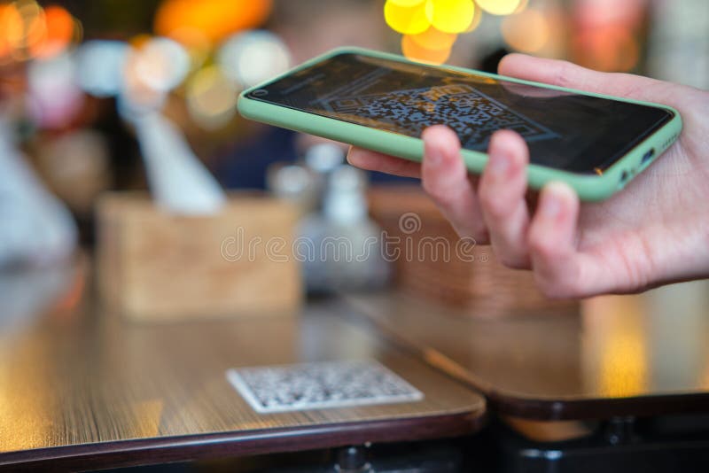 Closeup of Guest Hand Ordering Meal in Restaurant while Scanning Qr ...