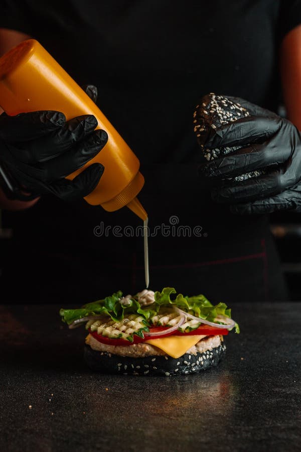 A Closeup of a Hamburger Cooking Process. Chef on Kitchen Table Making ...