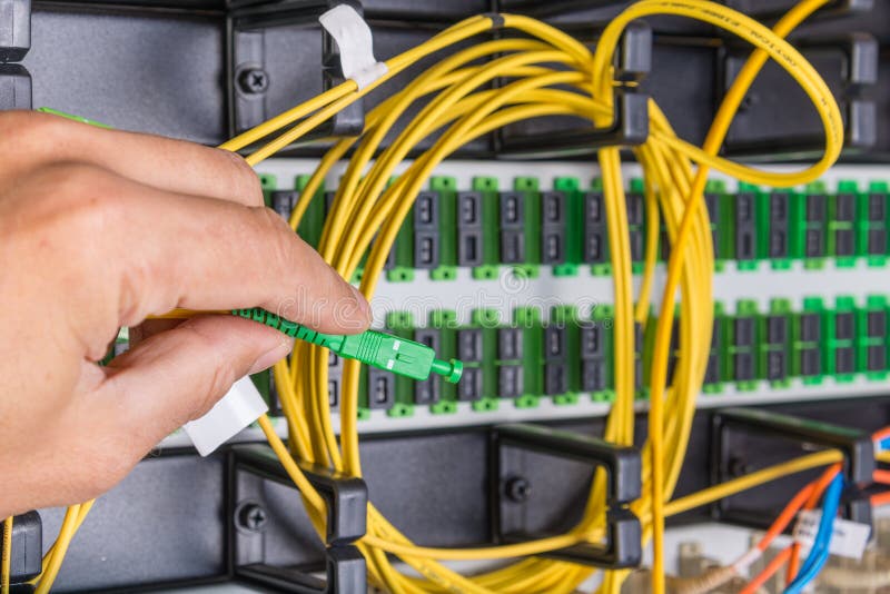 Hand of Engineer Plugging in Ethernet Cable into Server Switch P Stock ...