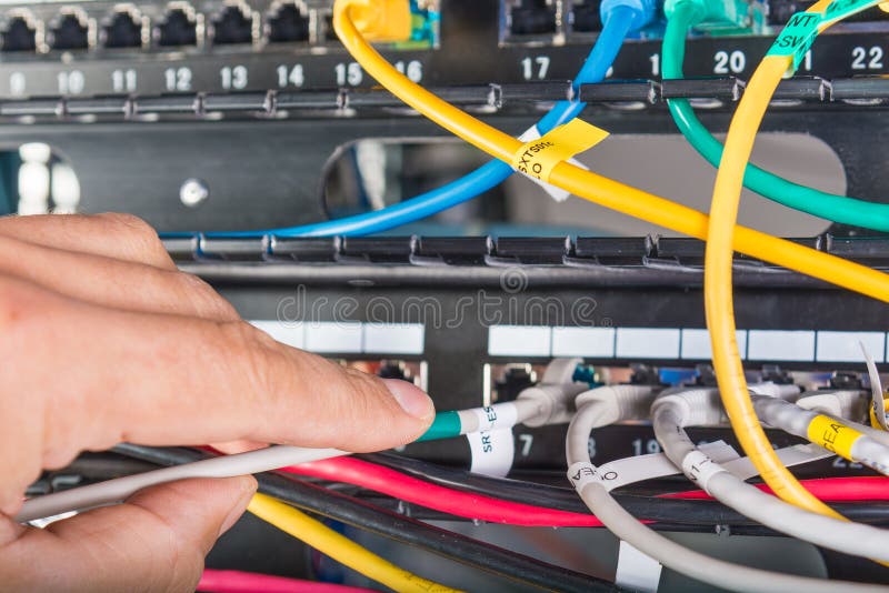 Hand of Engineer Plugging in Ethernet Cable into Server Switch P Stock ...
