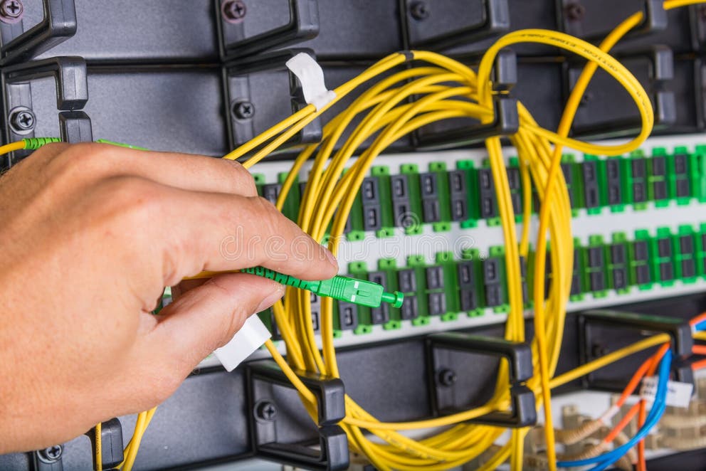 Hand of Engineer Plugging in Ethernet Cable into Server Switch P Stock ...