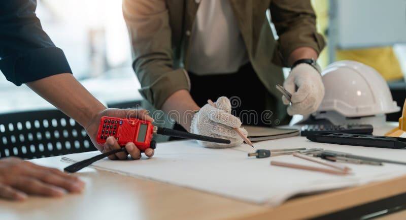Closeup Hand of Engineer Team with Construction Work Plan Discuss ...