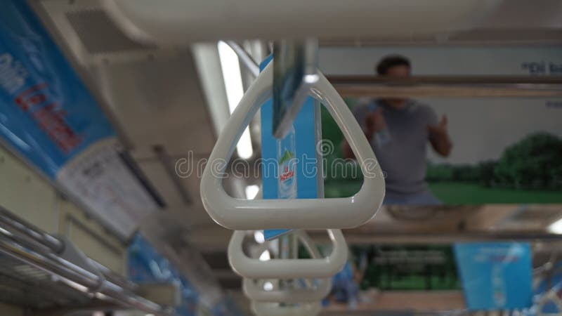Holding train handle editorial stock image. Image of jakarta - 263173099