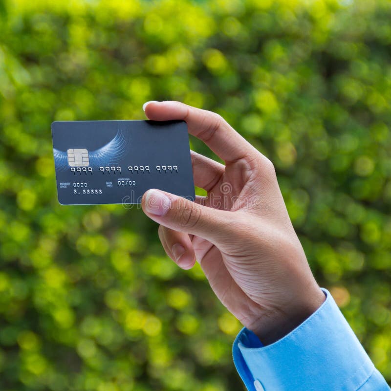 Closeup of Hand Holding and Giving Credit Card for Payment Stock Image ...