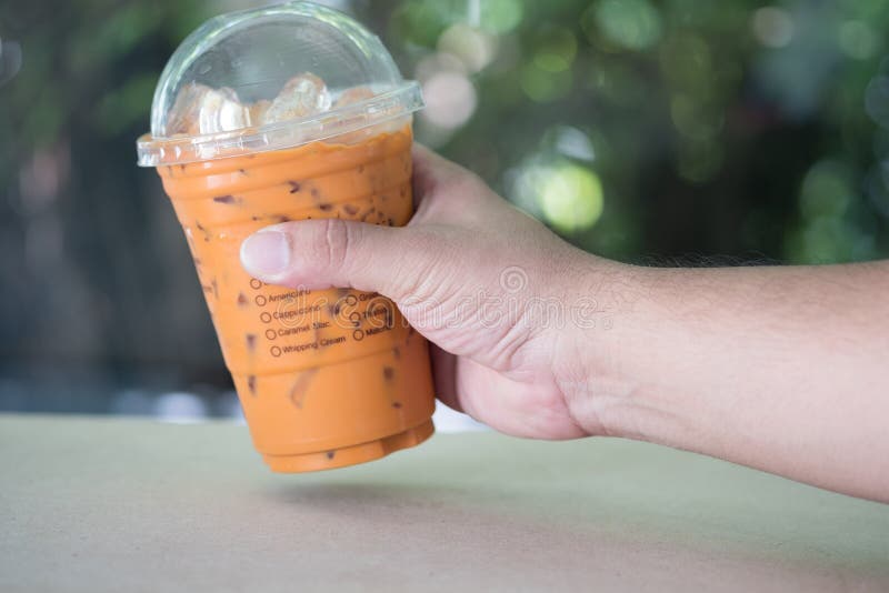 Hand Holding Glass of Thai Milk Tea Stock Image - Image of holding ...