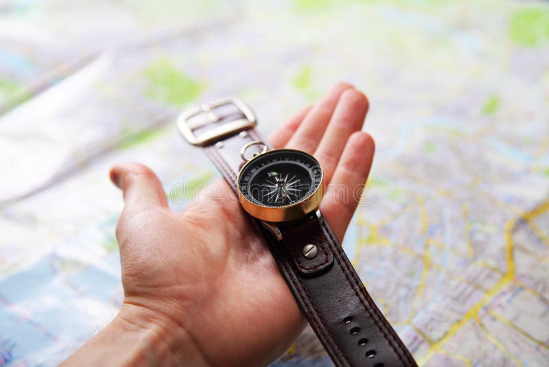 Closeup of Hand with Magnetic Compass Over a Map Stock Photo - Image of ...