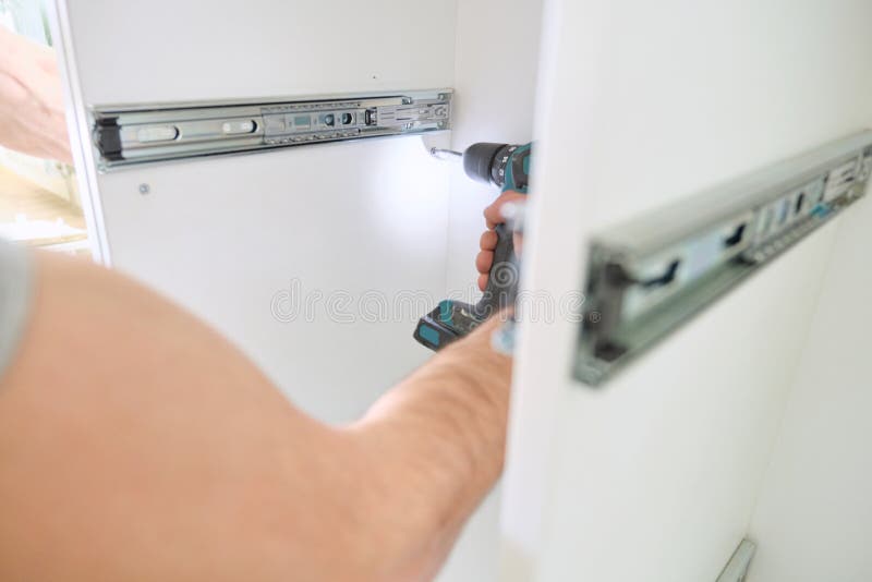 Closeup of Hand Worker Doing Furniture, Assembling Kitchen with ...