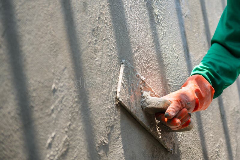 Closeup Hand of Worker Plastering Cement at Wall for Building House ...