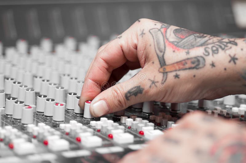 Closeup of Hands Covered with Tattoos Working on Mixer Console ...