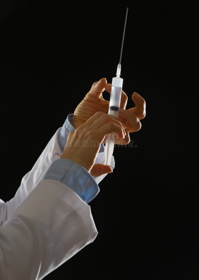 Closeup on Hands of Doctor Knocking on Syringe Stock Image - Image of ...